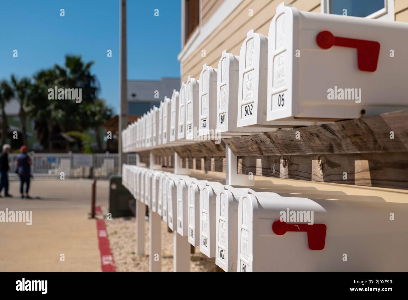White US Mailboxes in two rows, closeup with shallow depth of field ...