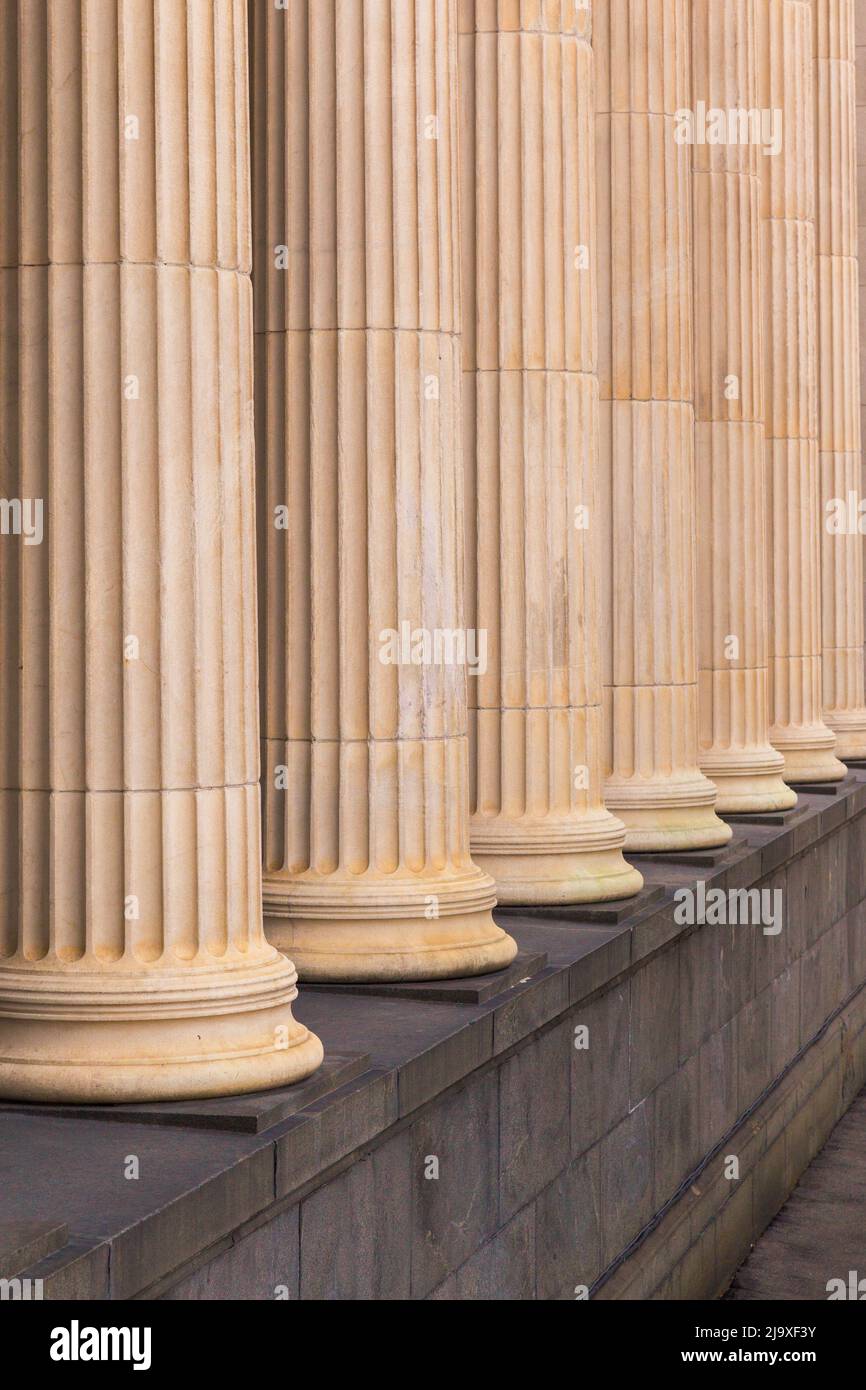 Many old greek columns in a row Stock Photo - Alamy