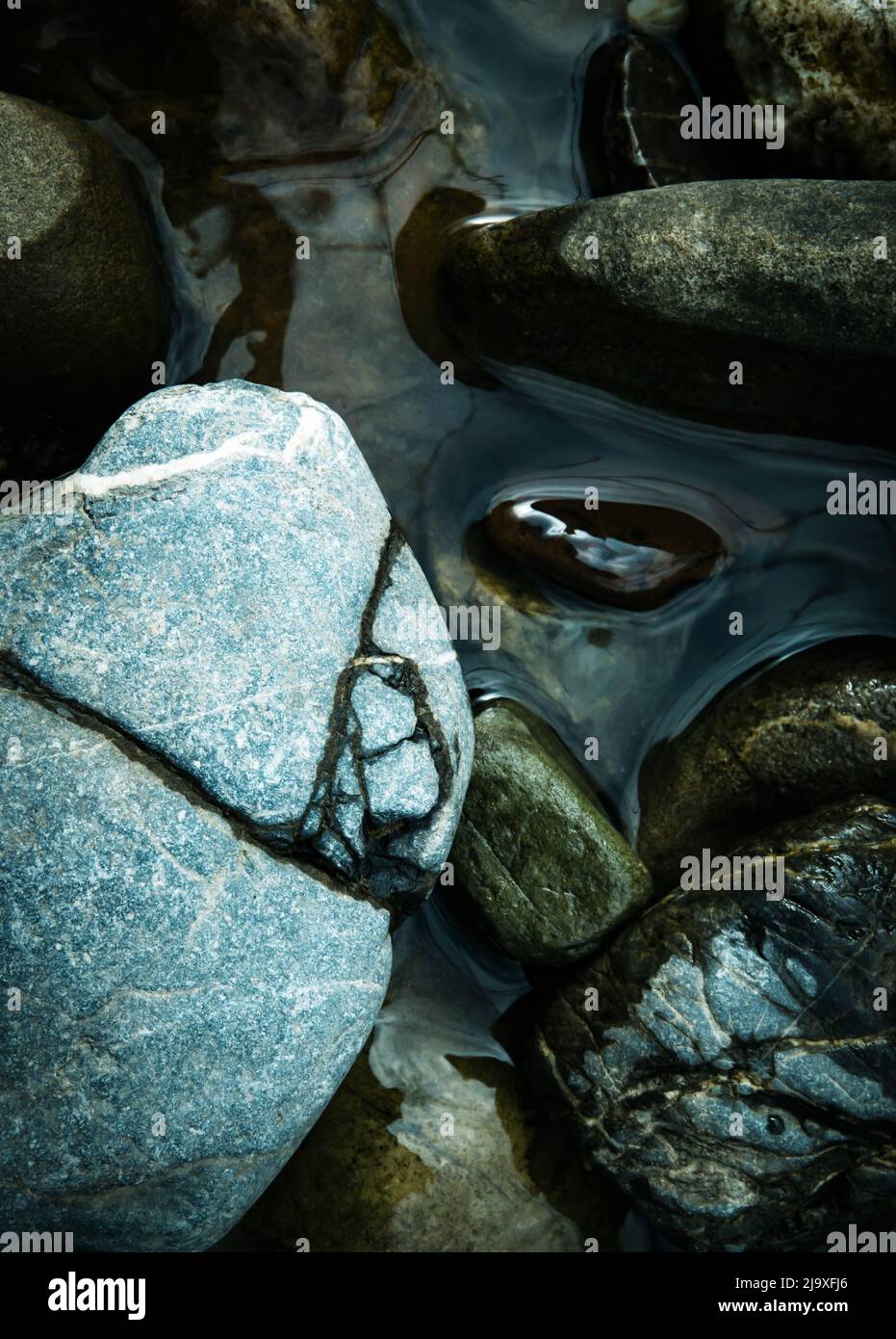 abstract background Round rocks in water Stock Photo - Alamy