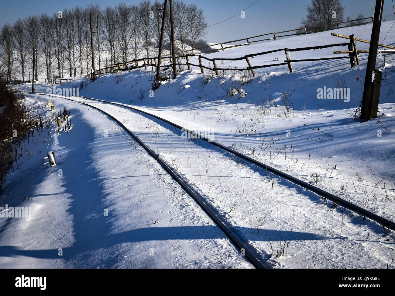 seasonal background snow covered railway track Stock Photo - Alamy