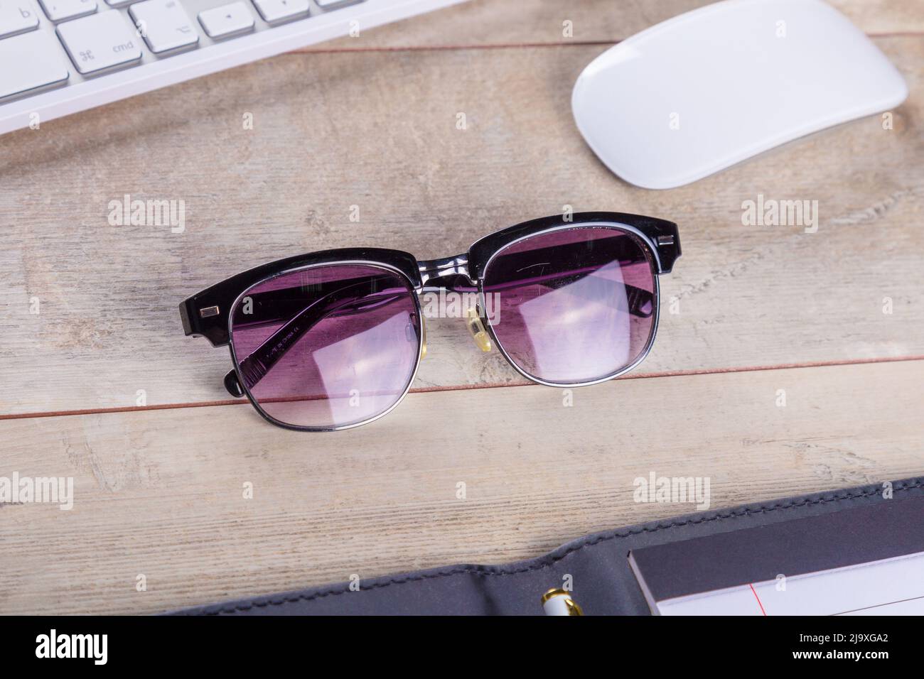 Diary notepad with accessories on table Stock Photo - Alamy