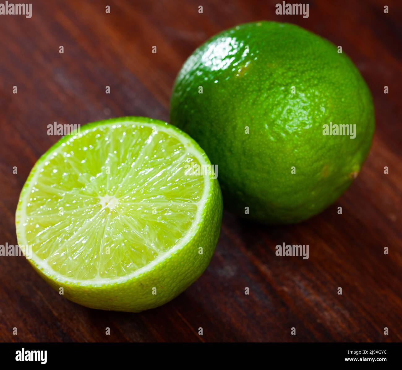 Sliced fresh juicy limes Stock Photo - Alamy