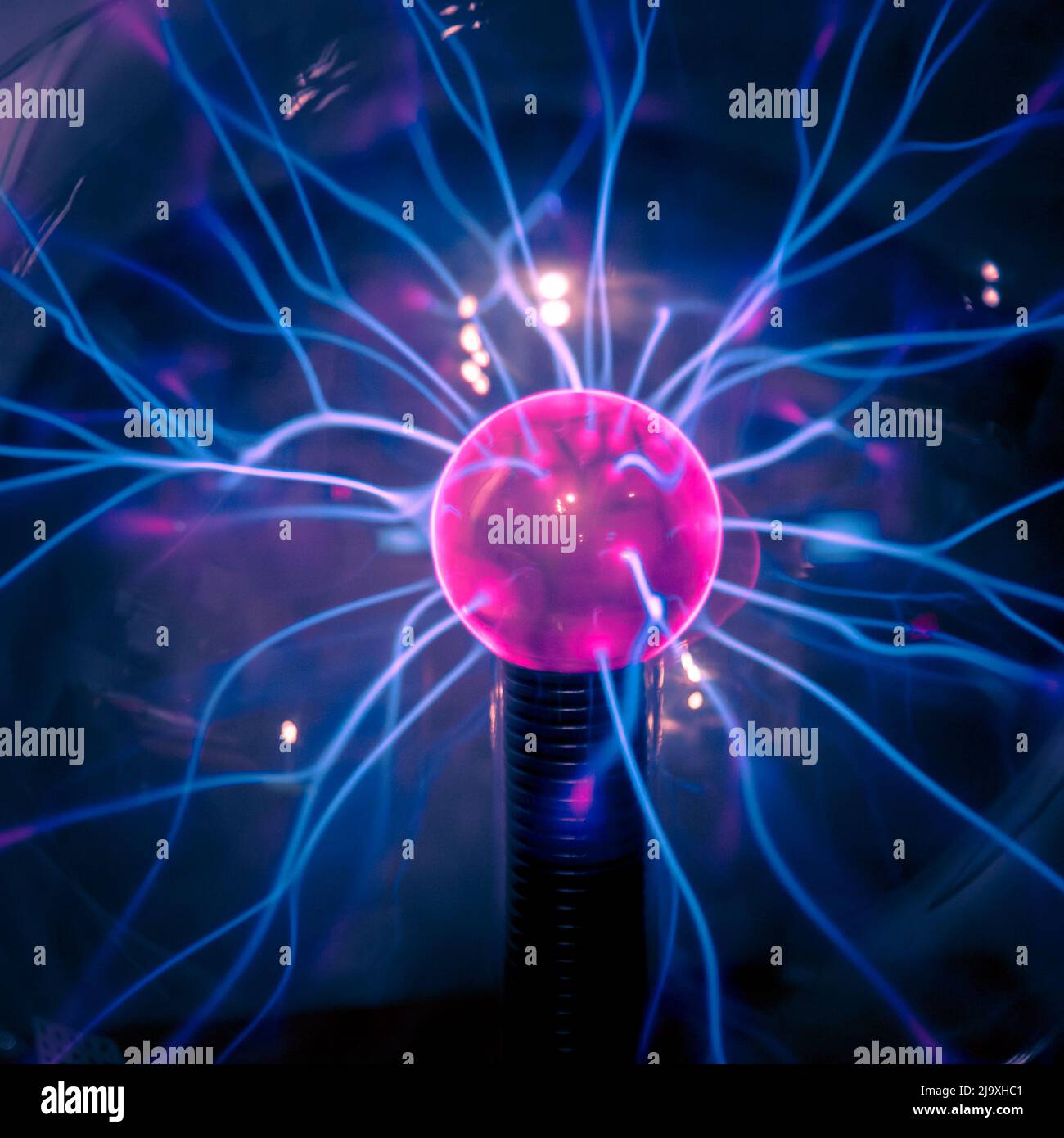 Plasma ball rays in the dark Stock Photo - Alamy