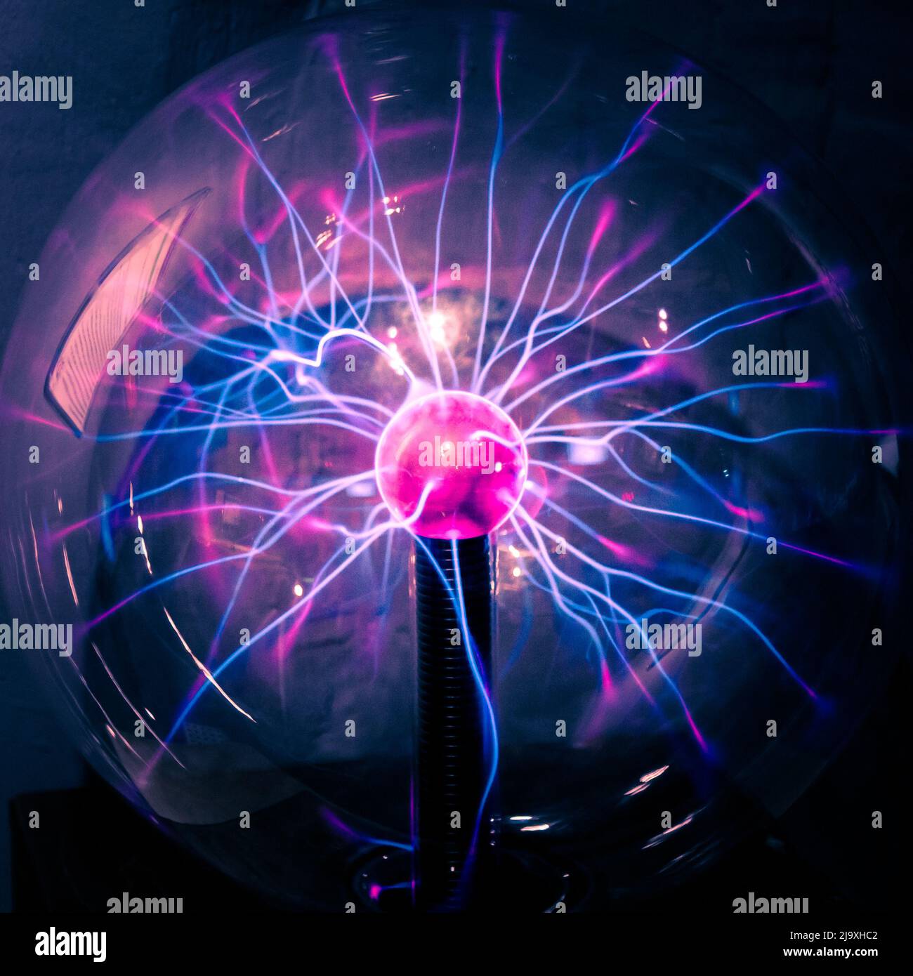 Plasma ball rays in the dark Stock Photo - Alamy