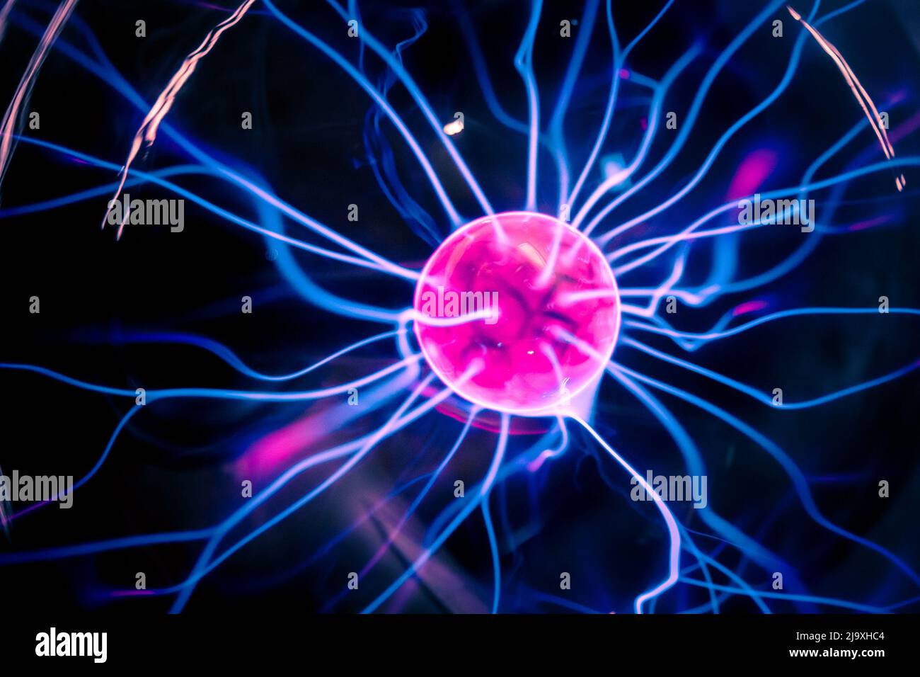 Plasma ball rays in the dark Stock Photo - Alamy