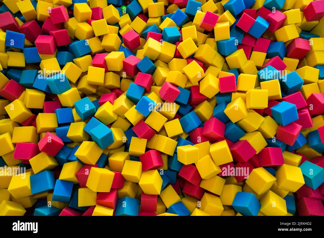 Colored foam rubber cubes background Stock Photo - Alamy