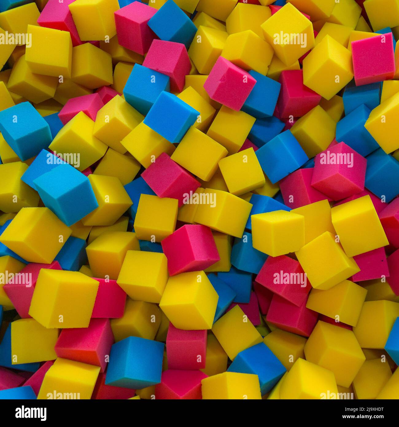 Colored foam rubber cubes background Stock Photo - Alamy