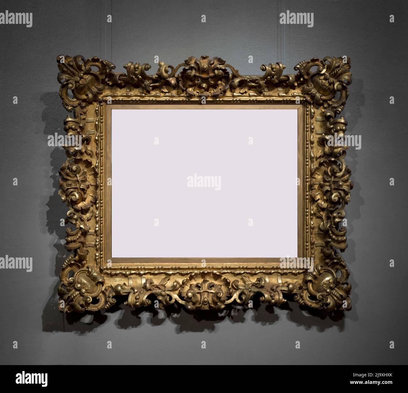 Gold empty frame on white wall Stock Photo - Alamy