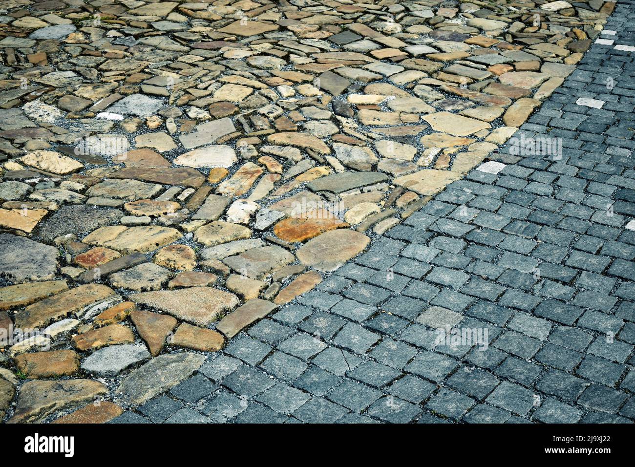 background or texture two kinds of stone paving next to each other ...