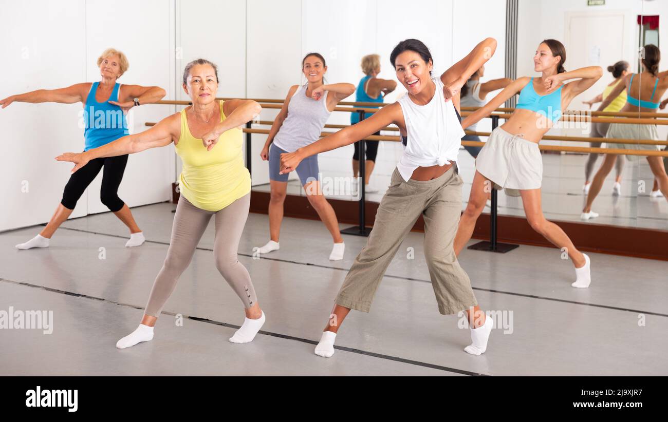 Various aged women dancing modern dance Stock Photo - Alamy