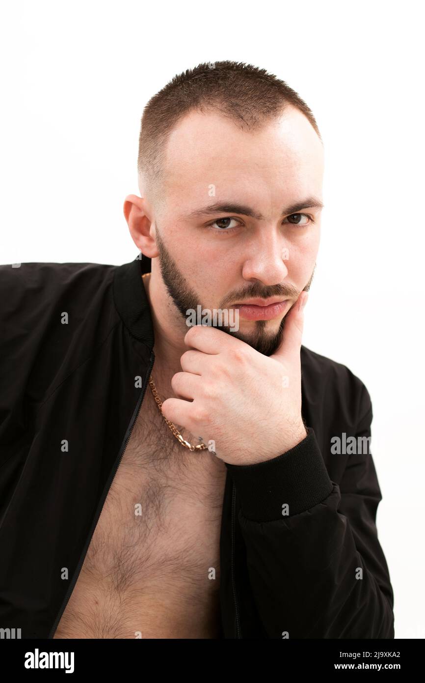 Headshot of unshaven man with beard 30s face posing, holding chin with ...