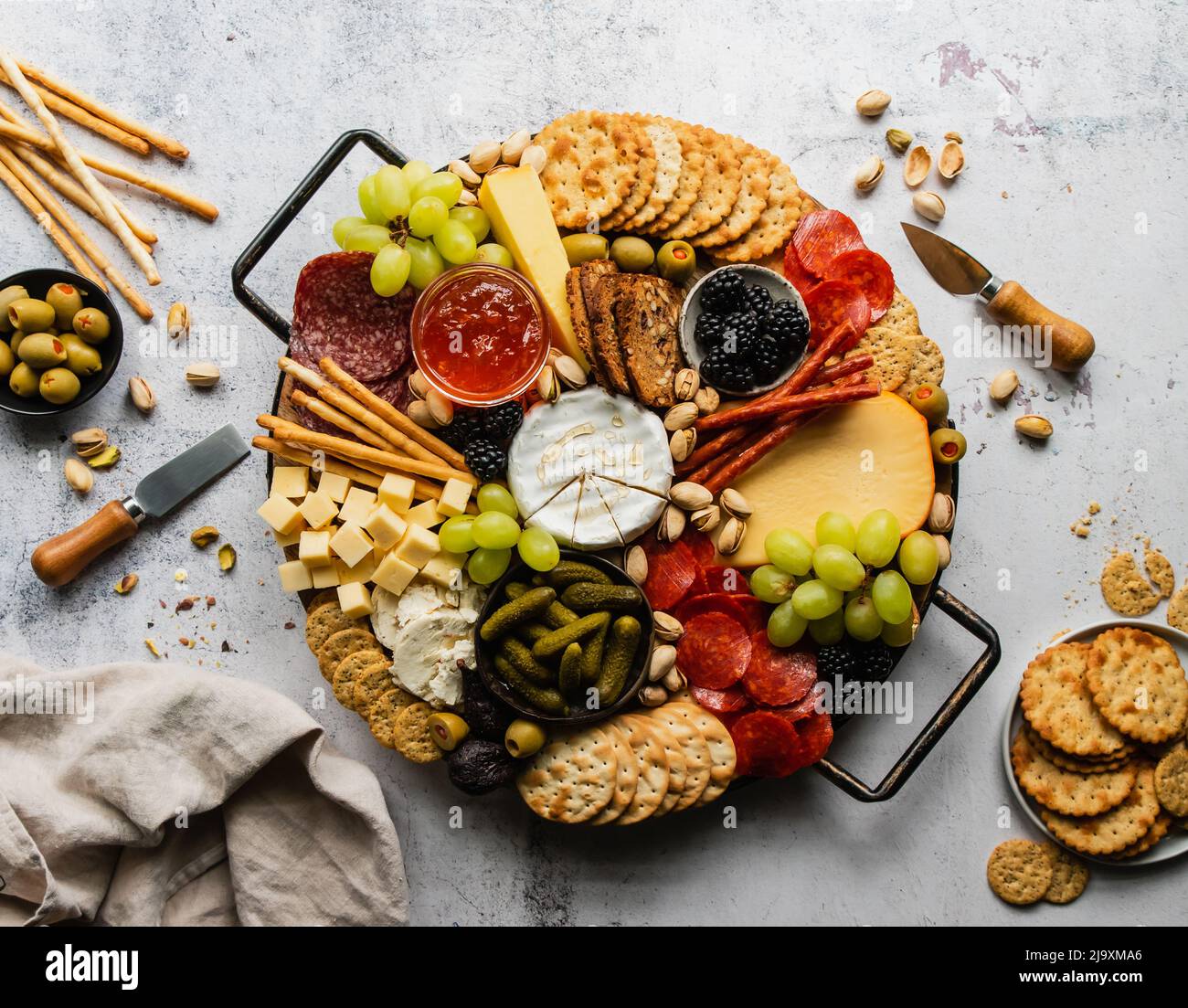 Overhead of charcuterie board of cheese, meat, crackers and fruit Stock ...