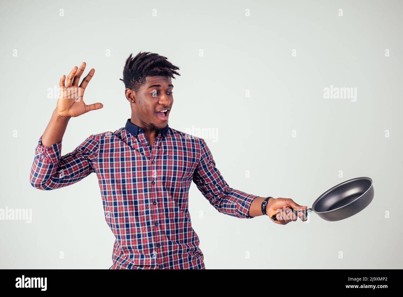 african american chef kitchener holding a frying pan wizard man cooking ...