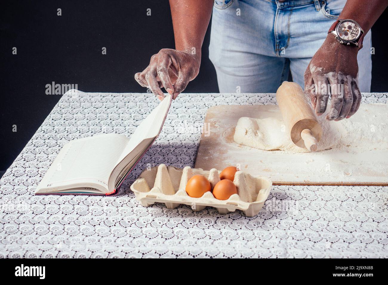 African American male cook chef boasts of pastry hands in flour baking ...