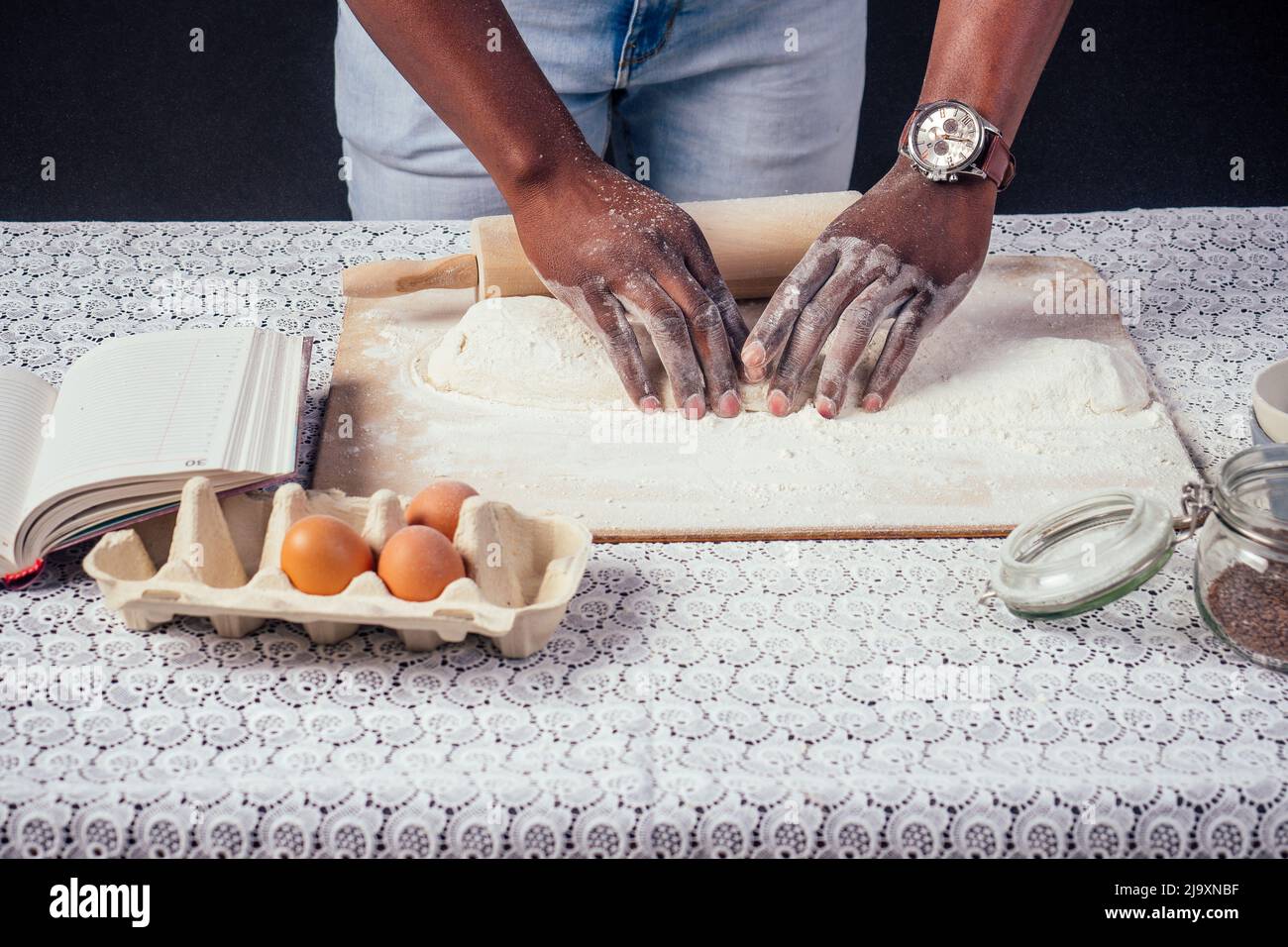 African American male cook chef boasts of pastry hands in flour baking ...