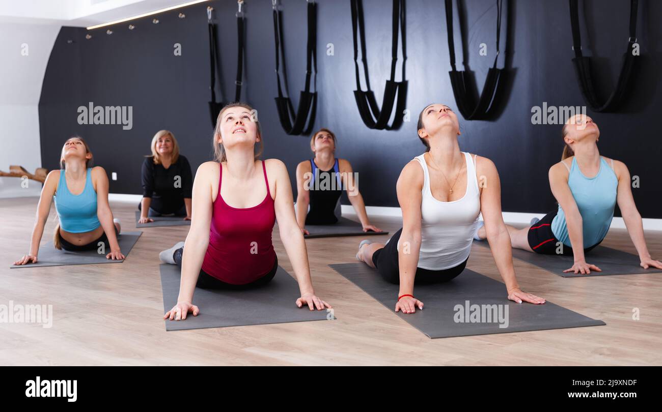 Females practicing yoga in studio Stock Photo - Alamy