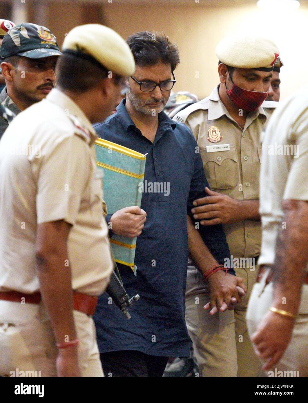 NEW DELHI, INDIA - MAY 25: JKLF Chief Yasin Malik being escorted by ...