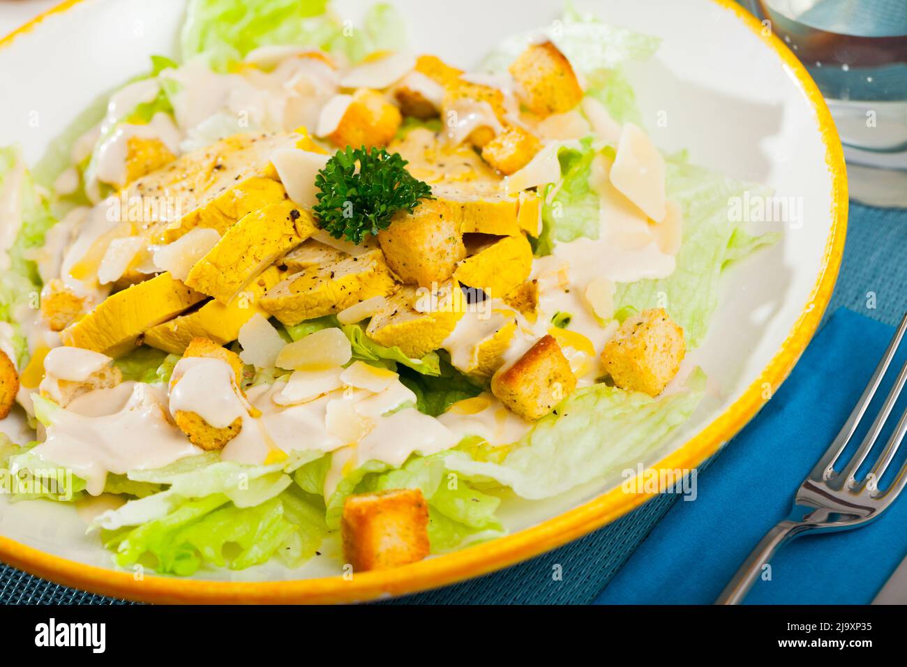 Plate of tasty Caesar salad Stock Photo - Alamy