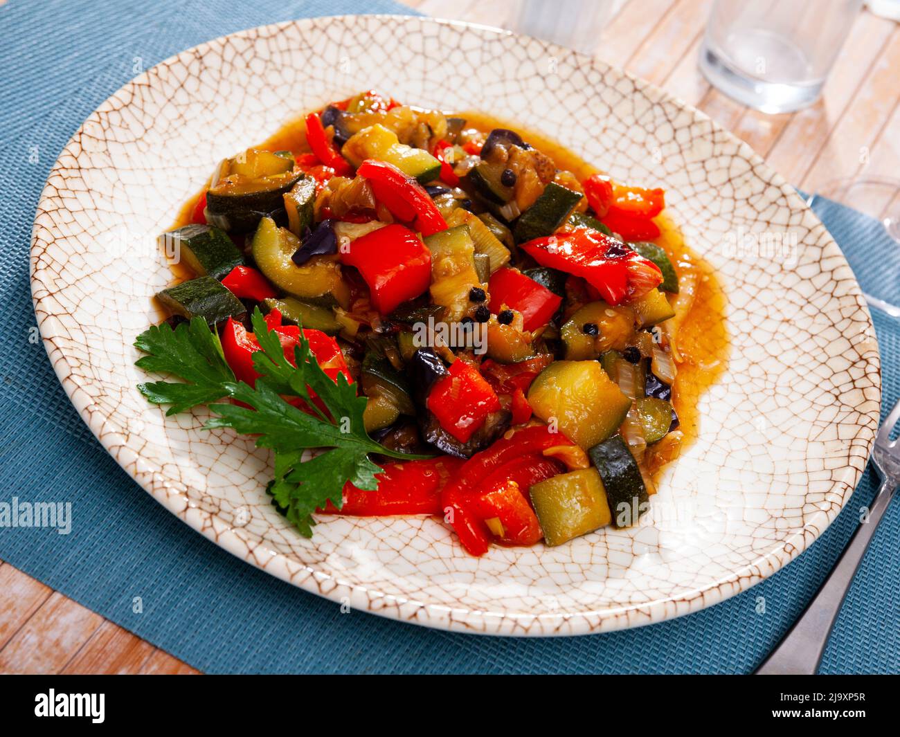 Healthy vegetarian dinner, braised vegetables on plate Stock Photo - Alamy