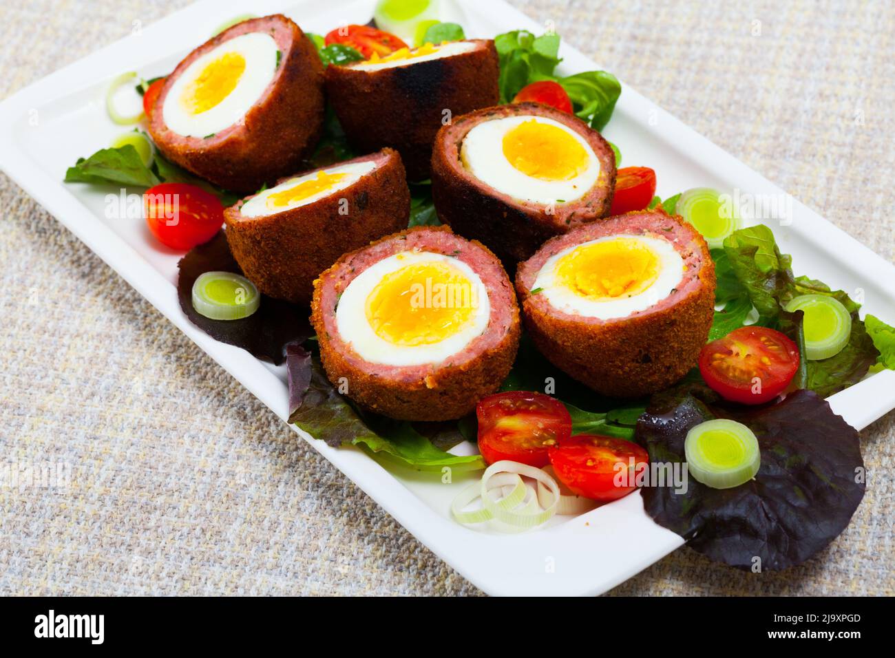 Scotch eggs with vegetable salad Stock Photo - Alamy