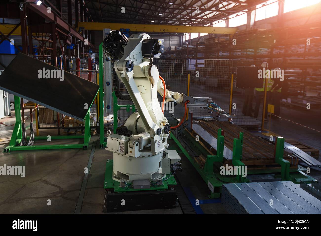 Robotic arm working with metal sheet Stock Photo - Alamy