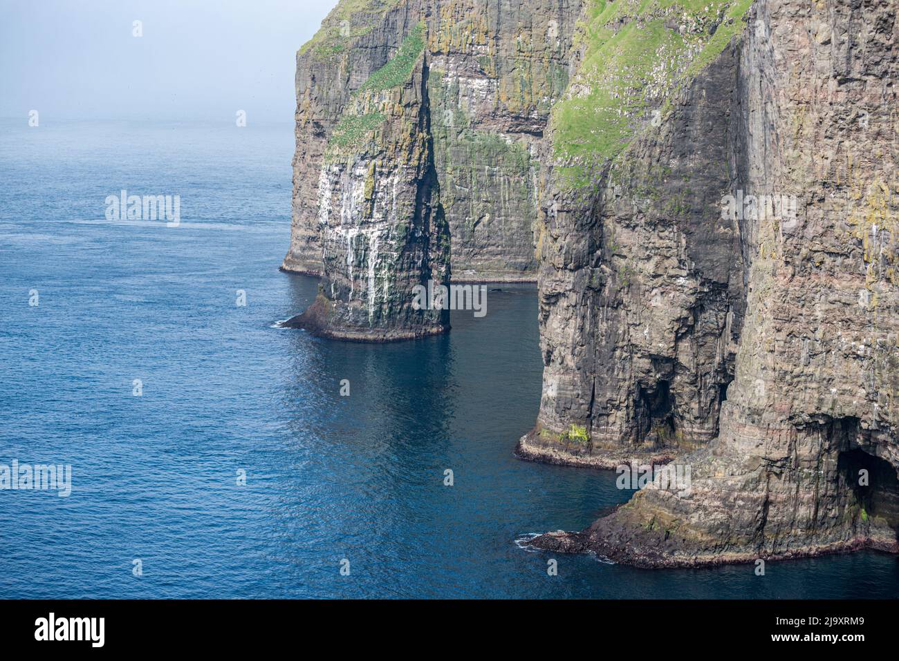 Asmundastakkur sea stack, Suduroy Island, Faroe Islands Stock Photo - Alamy