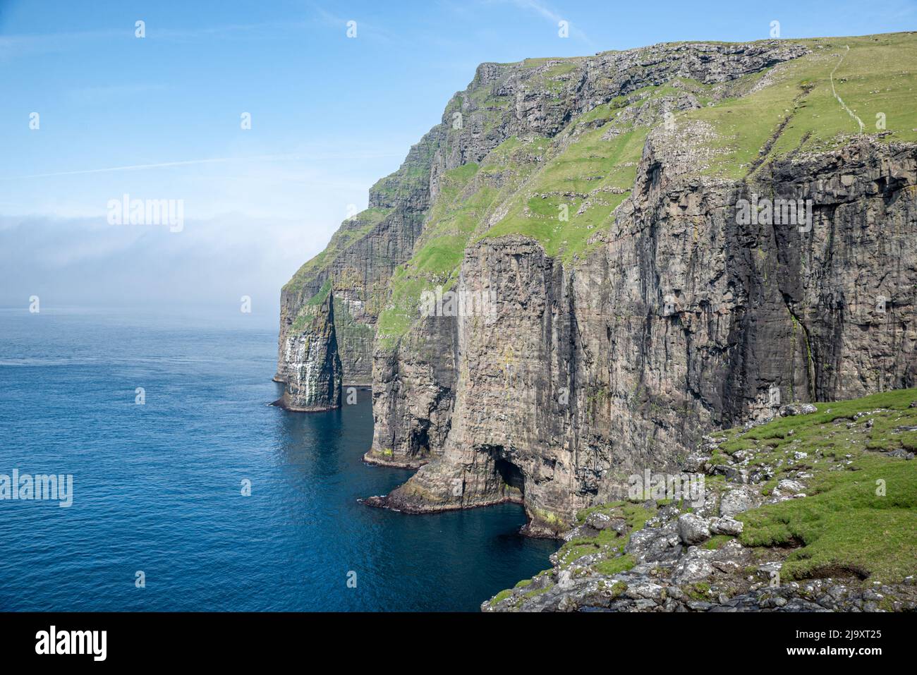 Asmundastakkur sea stack, Suduroy Island, Faroe Islands Stock Photo - Alamy