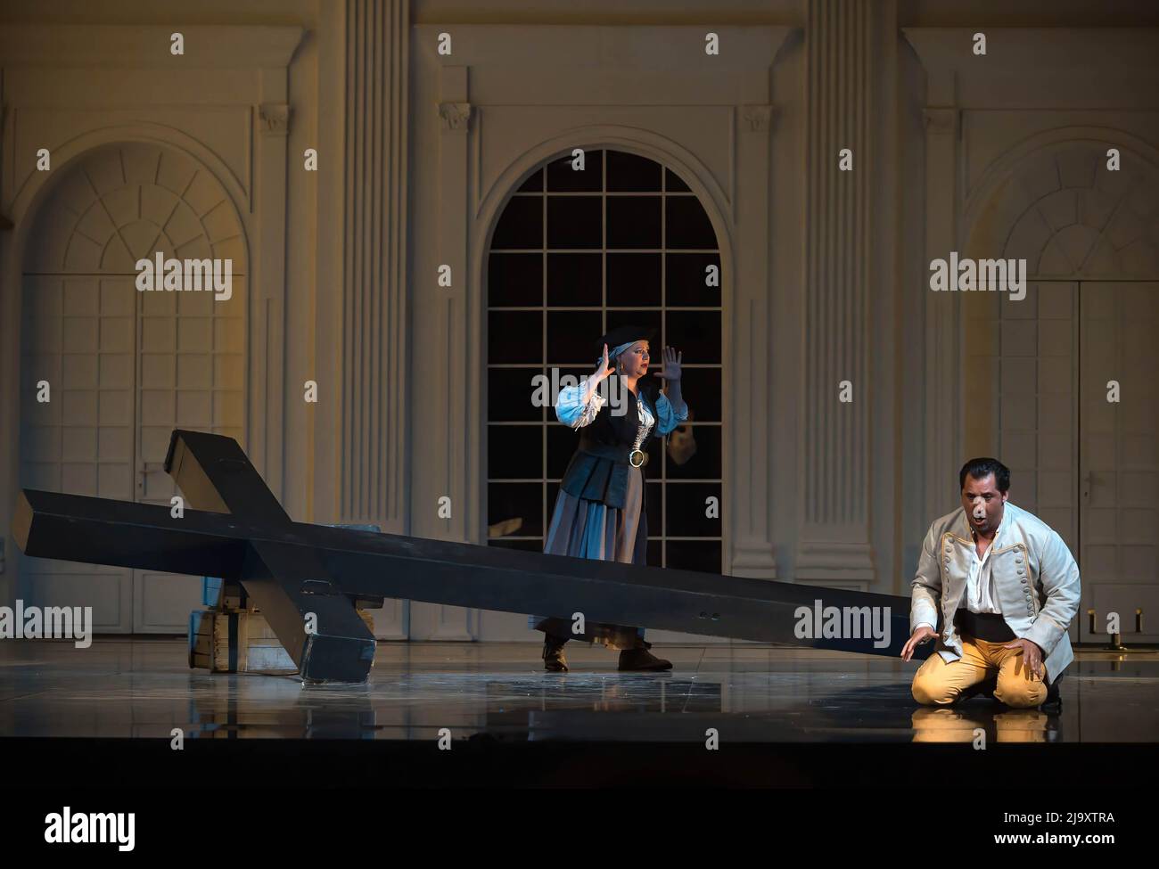 Actors perform with a huge cross during a general rehearsal of the ...
