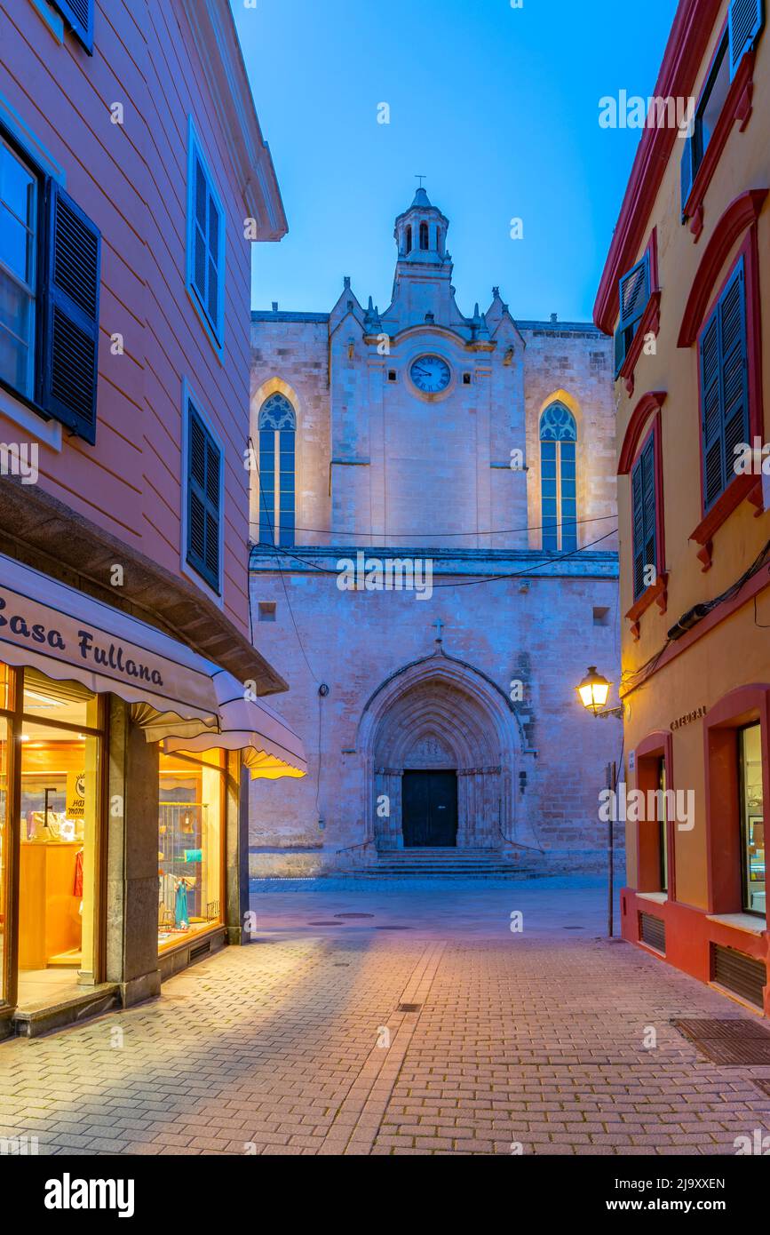 View of shop and Catedral de Santa Maria de Menorca at dusk, Ciutadella ...