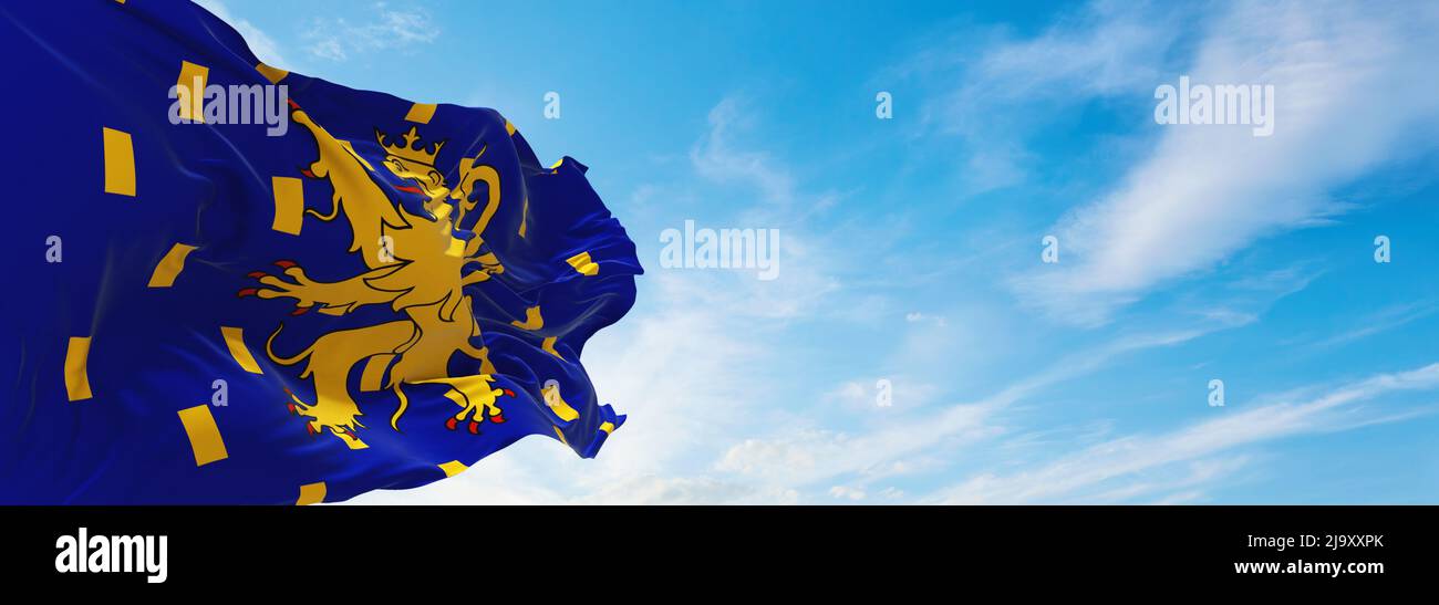 flag of Franche Comte, France at cloudy sky background on sunset ...