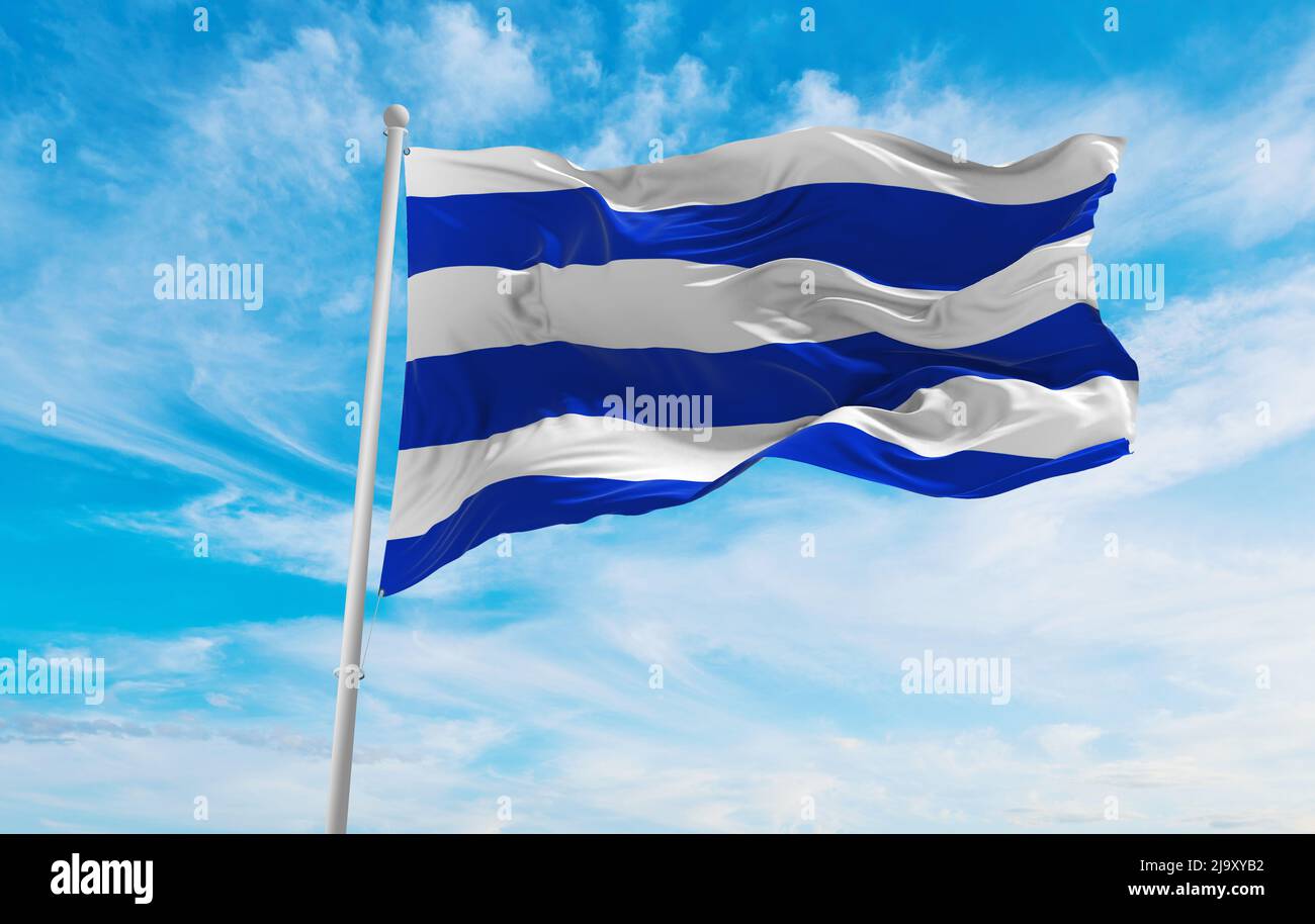 flag of Dunkirk, France at cloudy sky background on sunset, panoramic ...