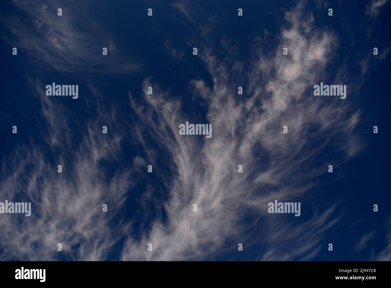 Wispy cirrus clouds hi-res stock photography and images - Alamy