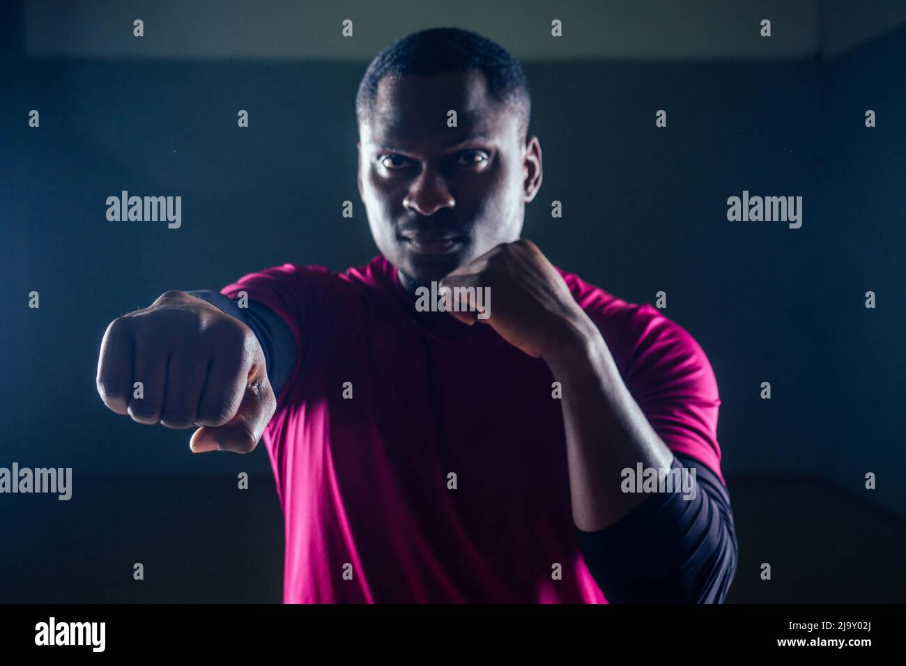 portrait of a young african american man sport boxer on fists black ...