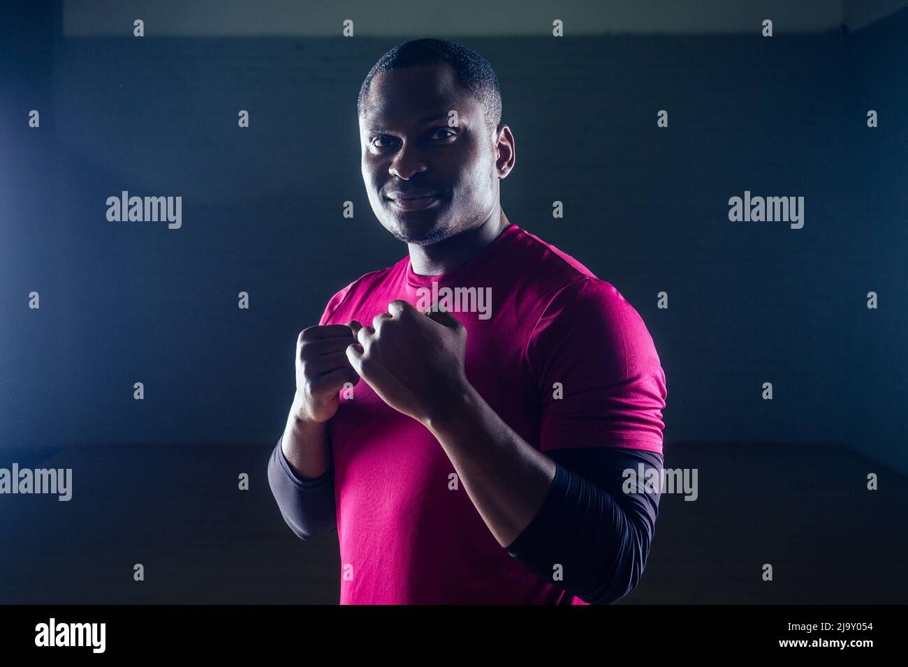 portrait of a young african american man sport boxer on fists black ...