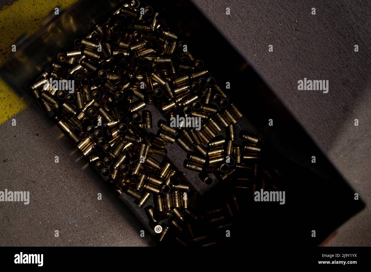 Spent shell casings sit within an ammunition can in the Combat Arms ...