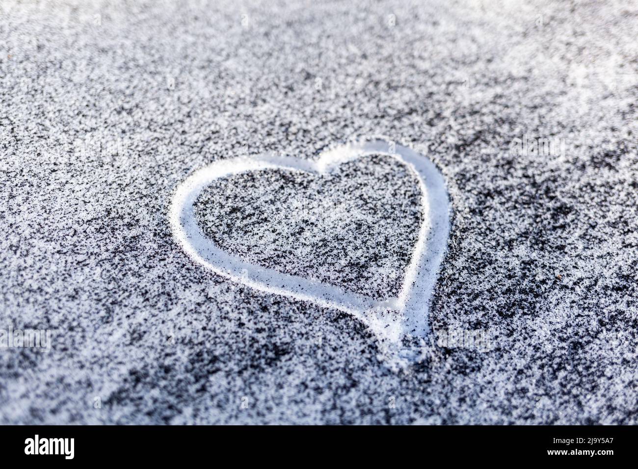 Black soot from the boiler room on white snow. Natural background. Snow ...