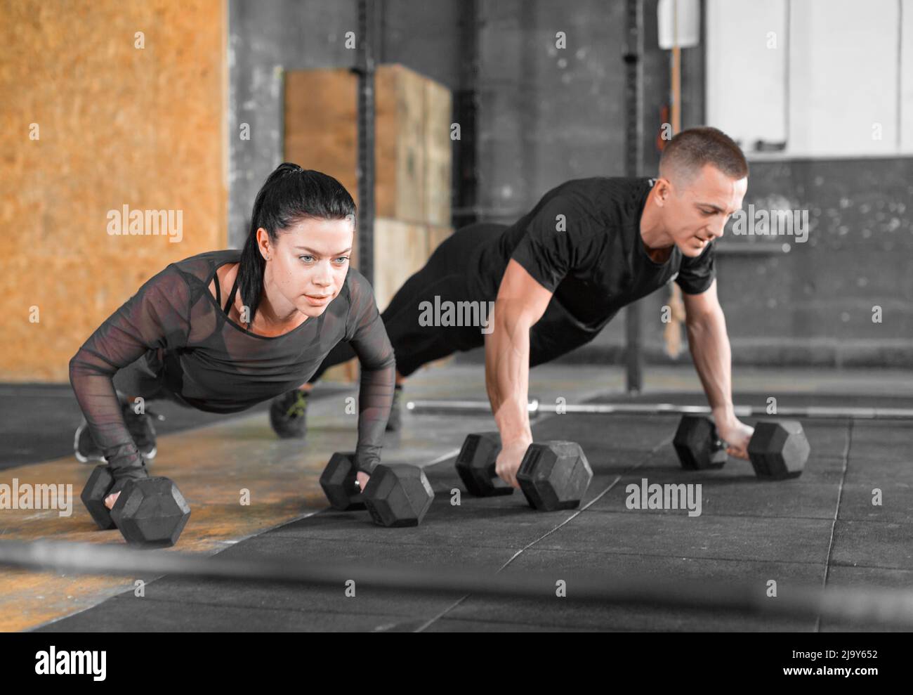Gym man and woman push-up. Strength pushup, Workout. Active and sporty ...