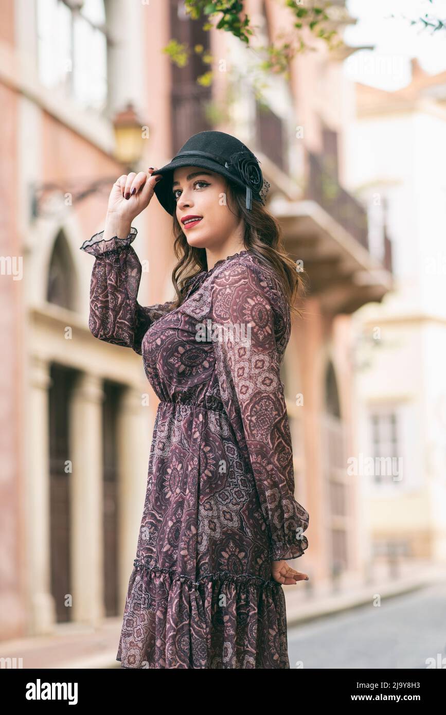 Beautiful woman standing outdoors looking away Stock Photo - Alamy