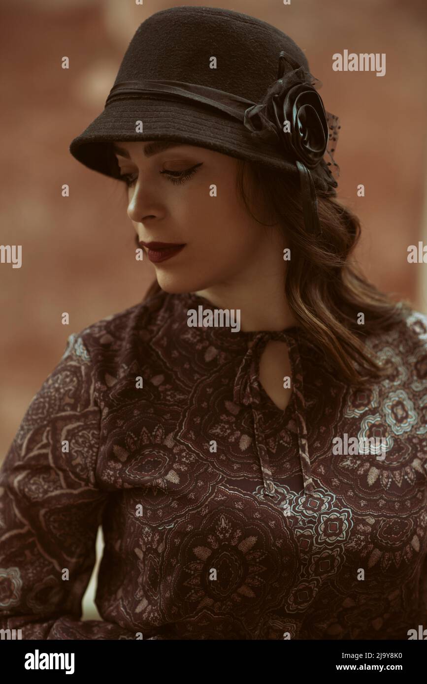 Beautiful woman looking down outdoors Stock Photo - Alamy