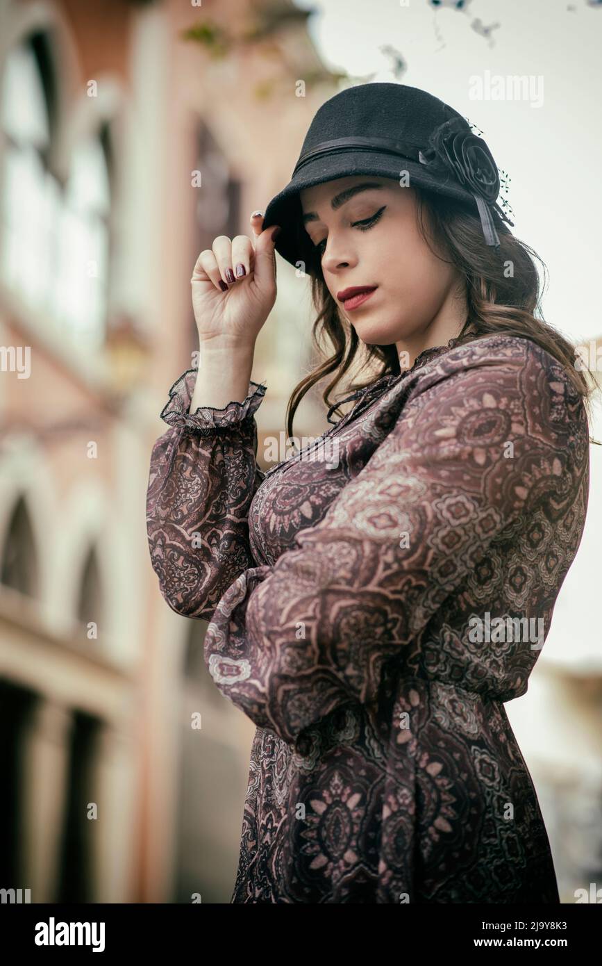 Beautifulwoman looking down outdoors Stock Photo - Alamy