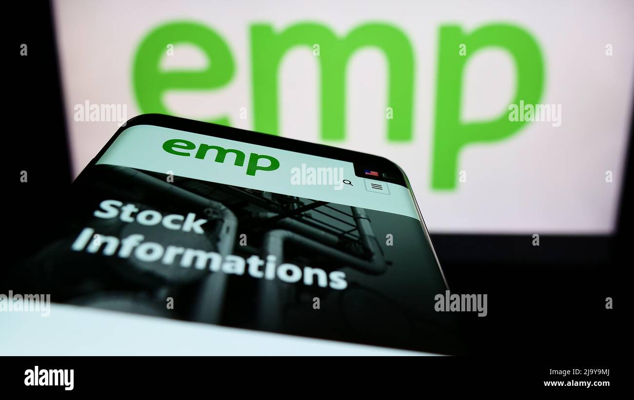 Mobile phone with webpage of company PT Energi Mega Persada Tbk (EMP ...