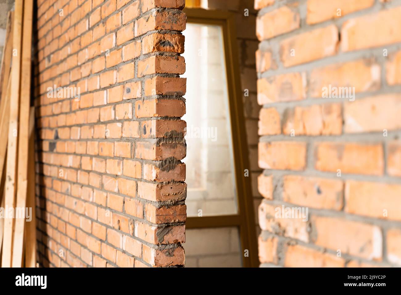 Thin brick wall between rooms in the house. The process of planning a ...
