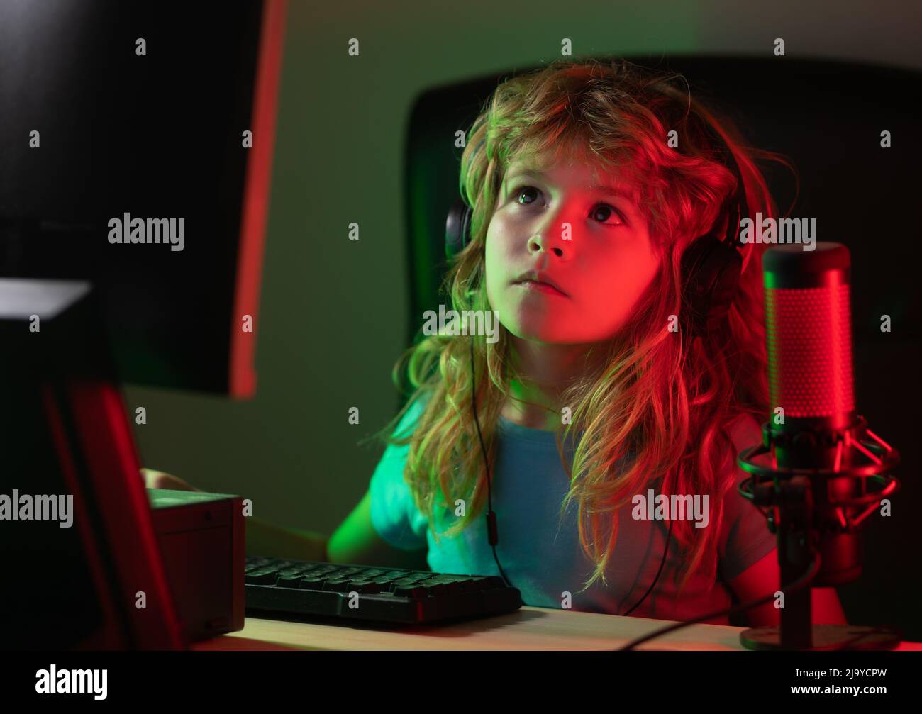 Child with pc computer at night. Overuse and addiction kids from ...