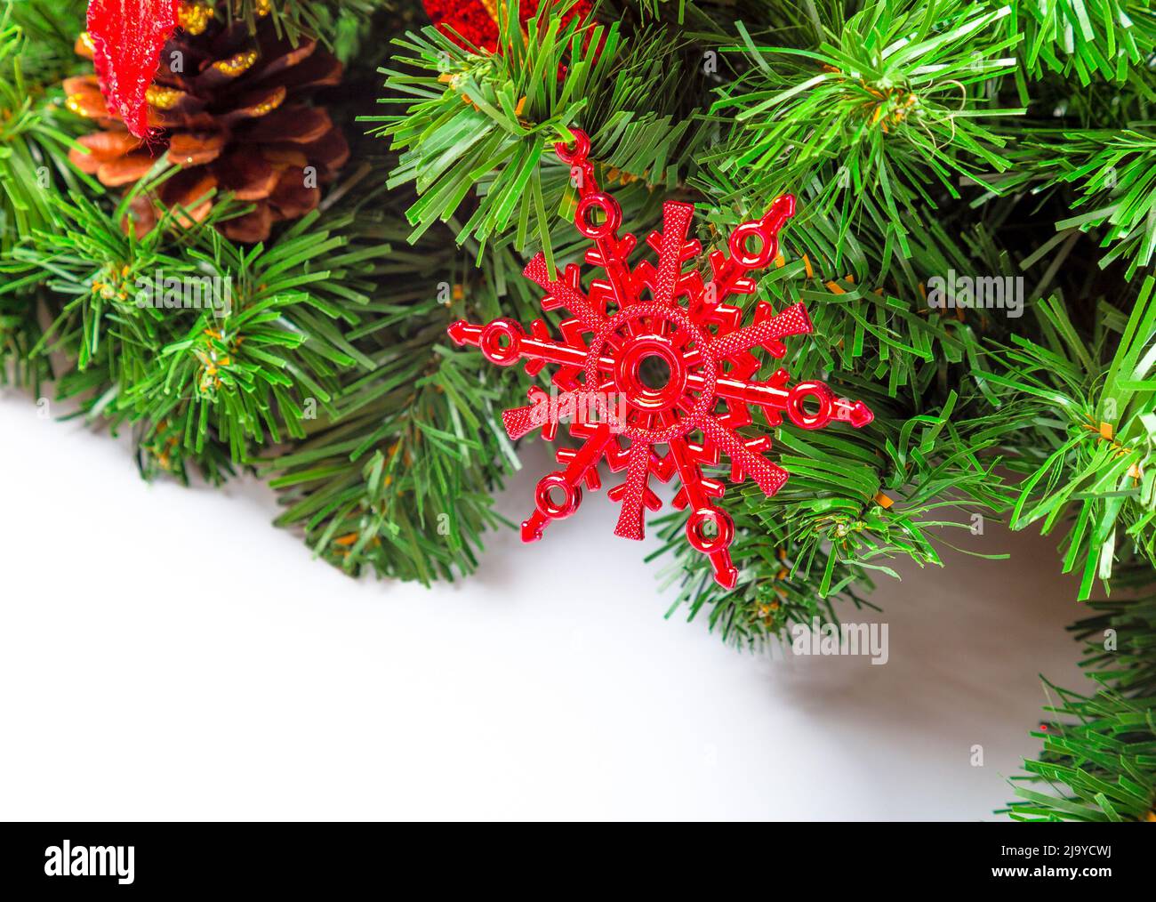 Christmas tree decorations, one red star on branch fir Stock Photo - Alamy