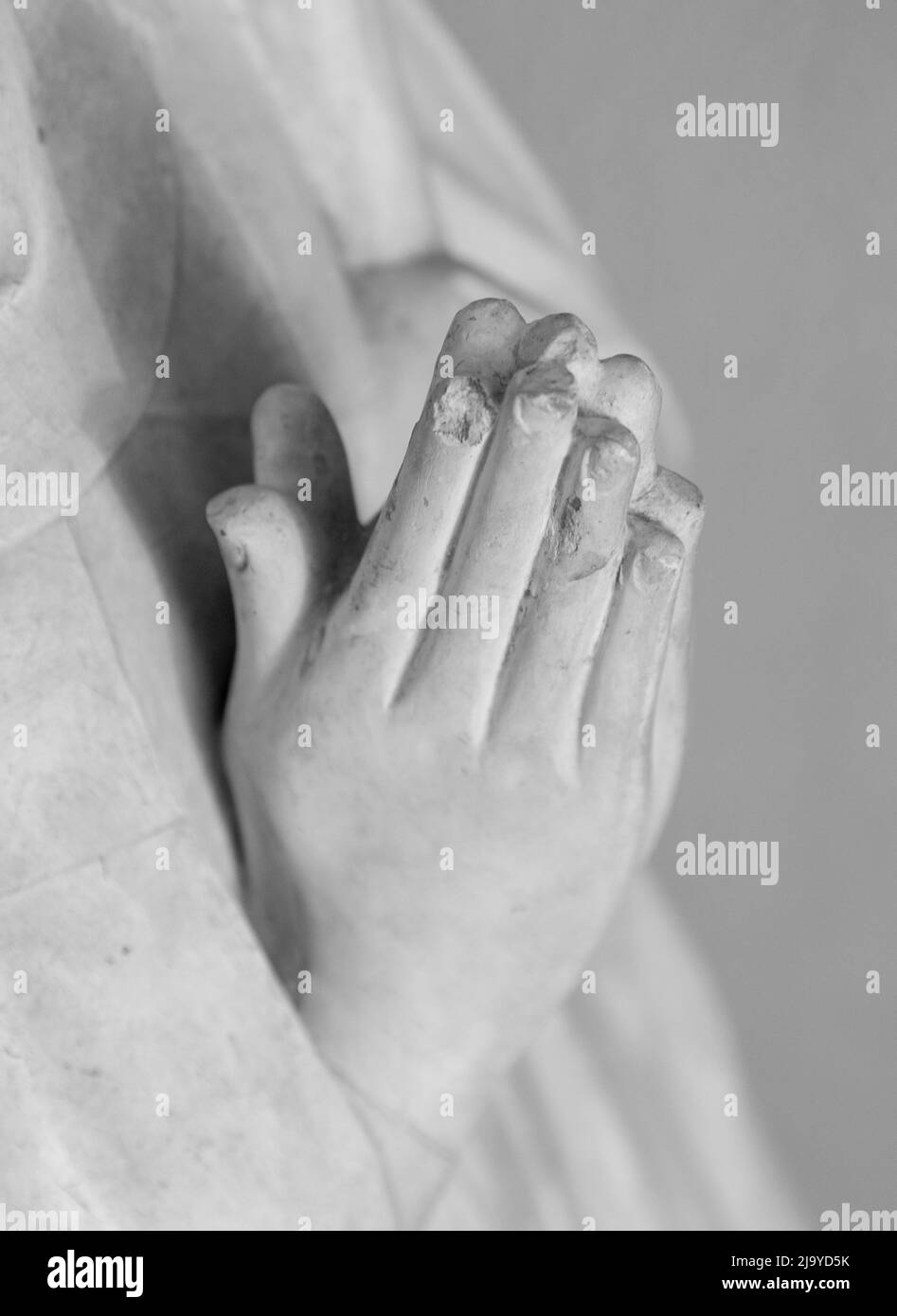 Man hands praying ancient sculpture Stock Photo - Alamy