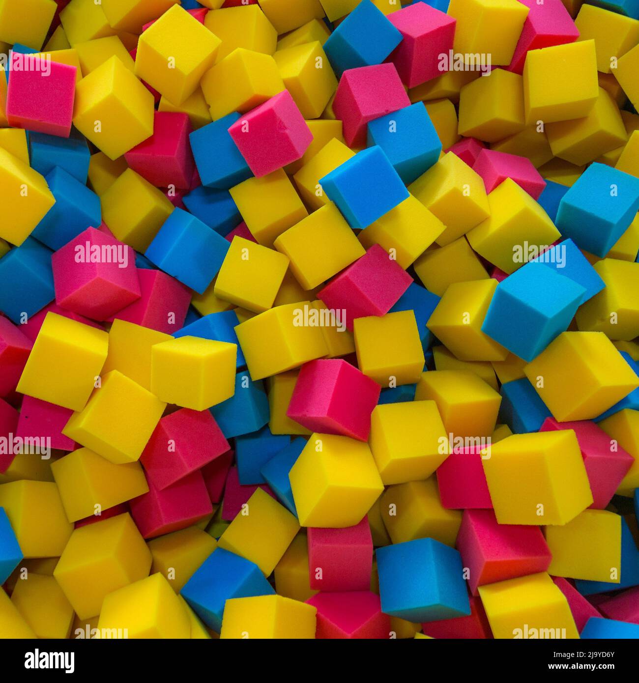 Colored foam rubber cubes background Stock Photo - Alamy