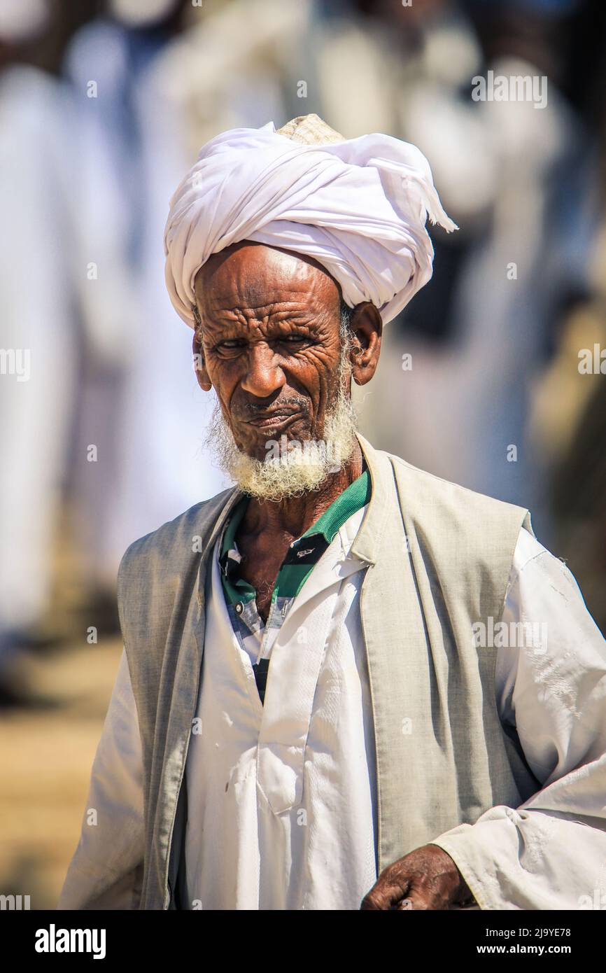 Local Eritrean Man in Traditional White dress on the Keren Camel animal ...