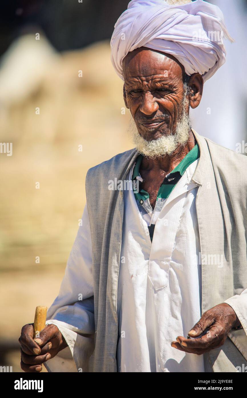 Local Eritrean Man in Traditional White dress on the Keren Camel animal ...