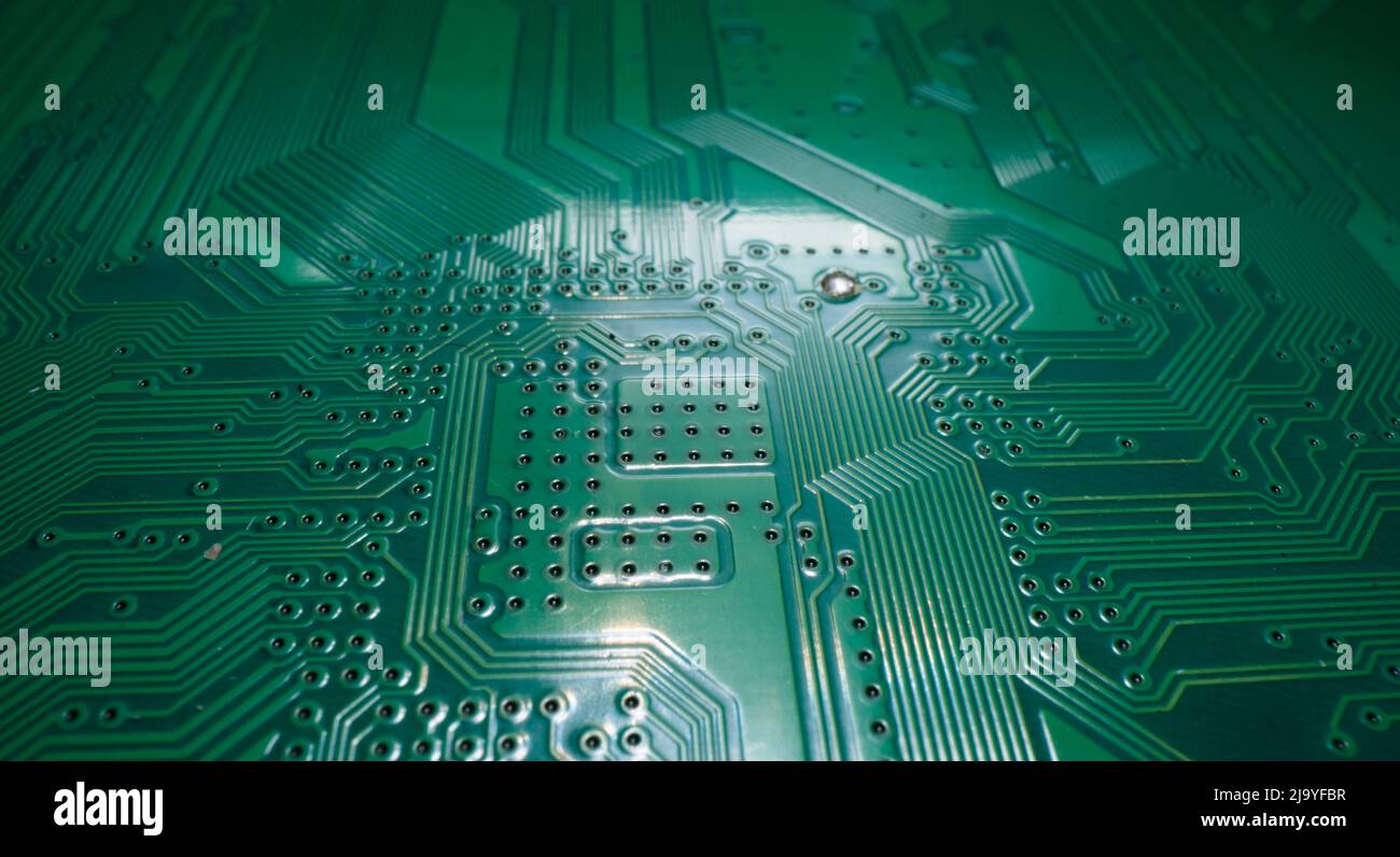 Technology background. High tech electronic circuit board background. Close-up macro electronic ...