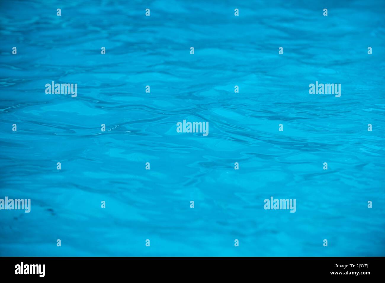 Water in swimming pool, background with high resolution. Wave abstract ...